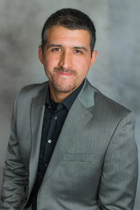 Sarmiento signs contract with publisher of new book | Fredonia.edu